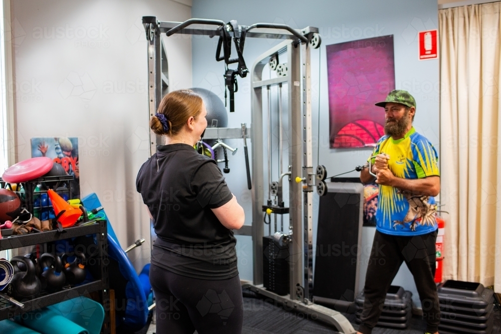 Image of Australian aboriginal man doing physiotherapy with physio ...