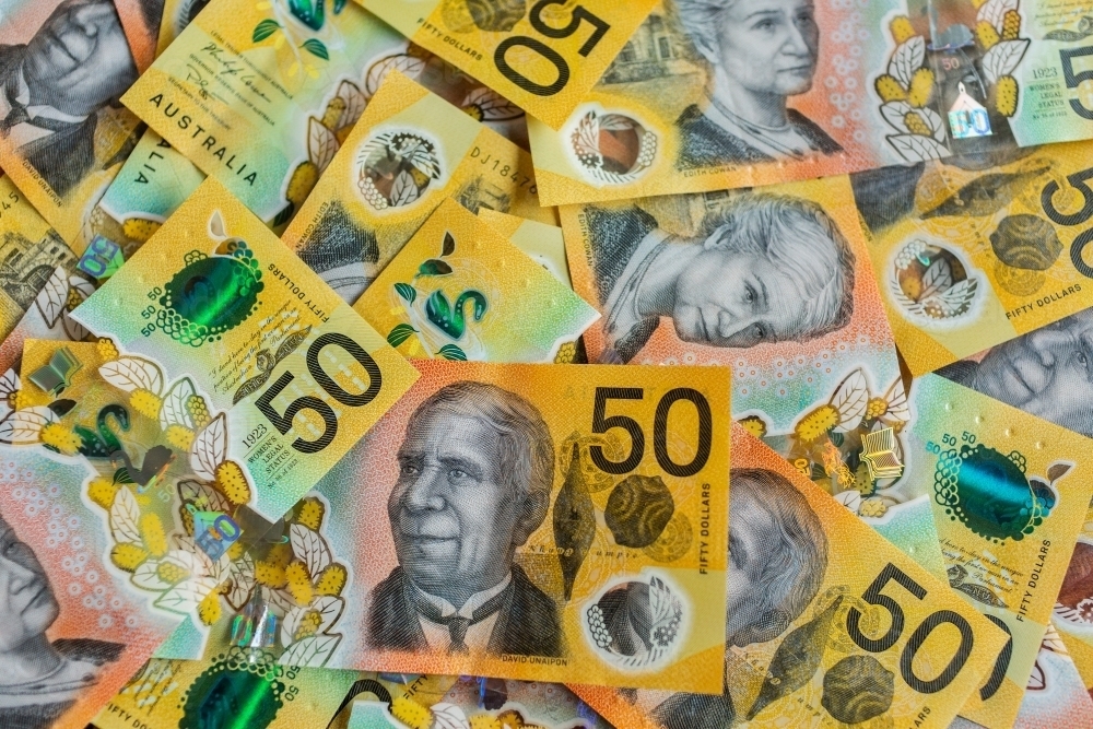 Image of Australian currency of fifty dollar notes scattered and ...