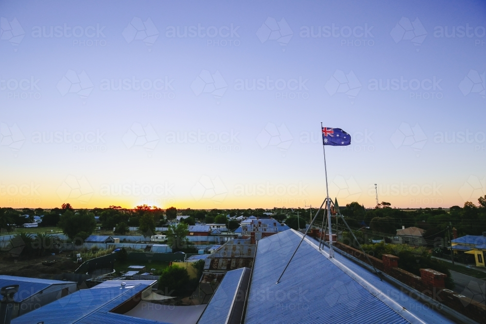 Image of Australian flag flying on roof of country pub in small ...