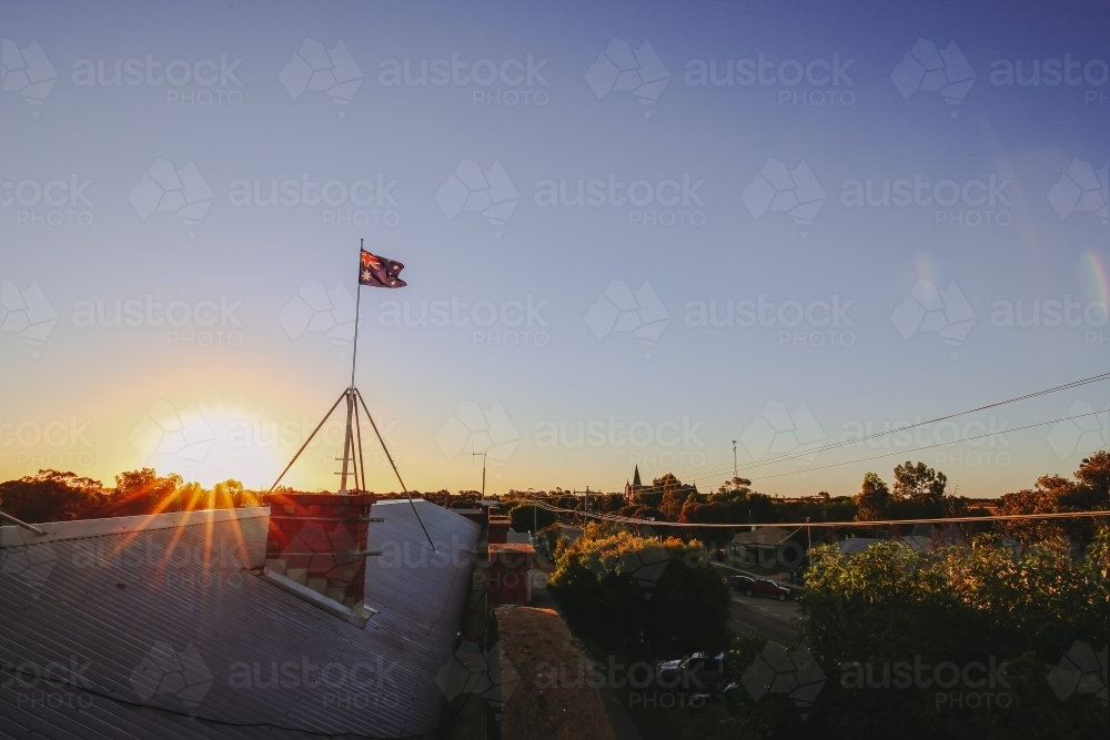 Image of Australian flag flying on roof of pub in small country town ...