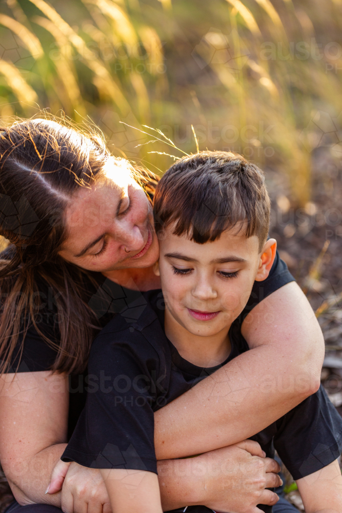 Image of Australian mum with her Aboriginal son together outside in ...