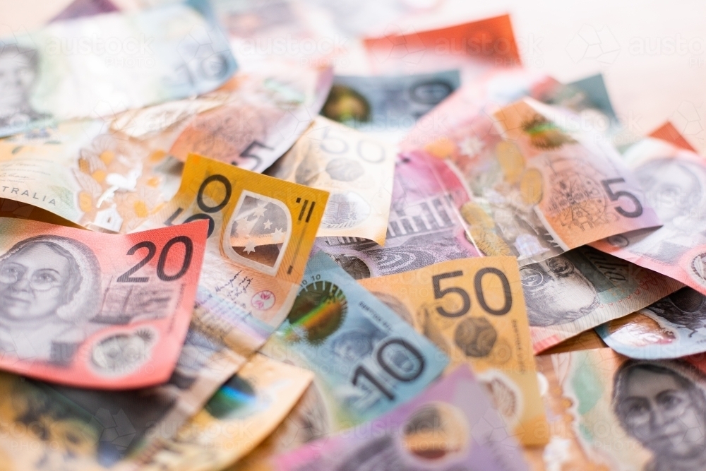 Image of Australian notes in a messy pile for a background - Austockphoto