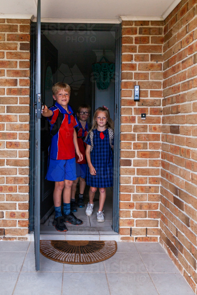 Image of Australian schoolkids leaving the house for school walking out ...