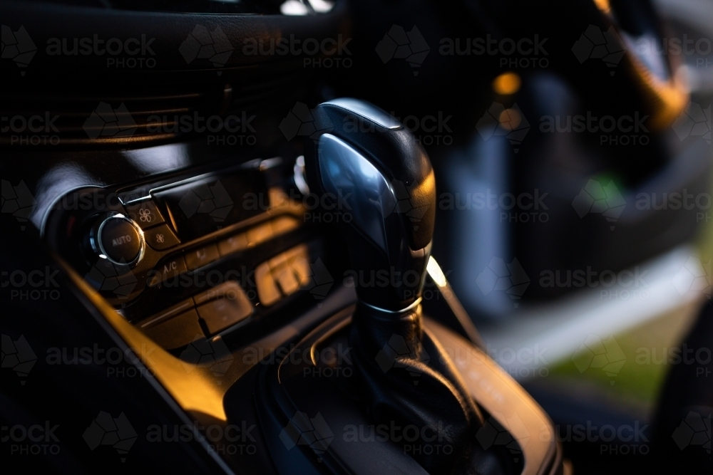 Image of Automatic car stick and air con button on the dash - Austockphoto