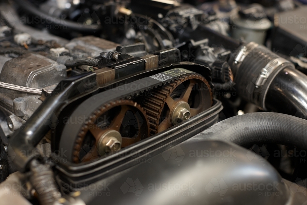 Image of Automotive work on engine of vehicle - Austockphoto