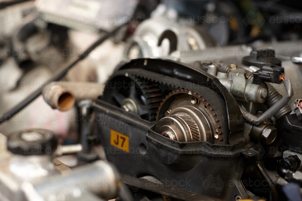 Image of Automotive work on engine of vehicle - Austockphoto