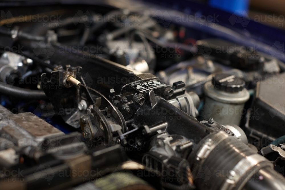 Image of Automotive work on engine of vehicle - Austockphoto