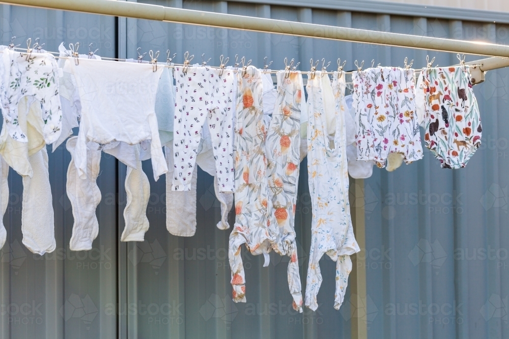 Image of Baby clothes, cloth nappy inserts hanging on washing line with ...