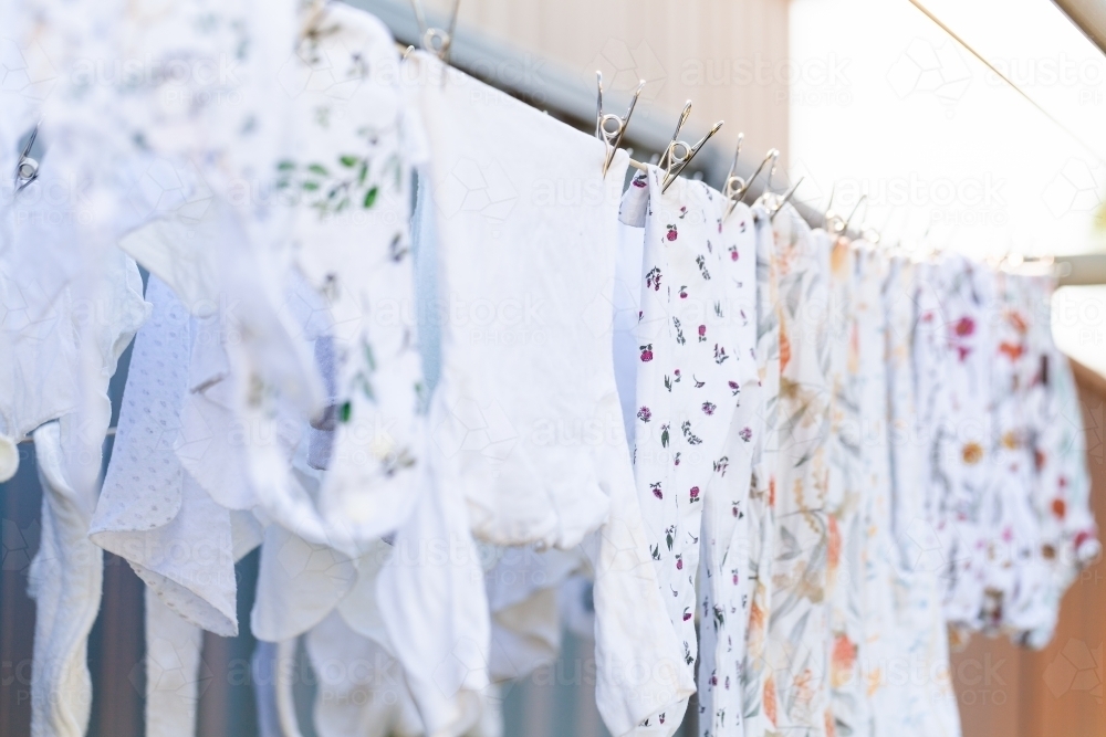 Image of Baby clothes, cloth nappy inserts hanging on washing line with ...