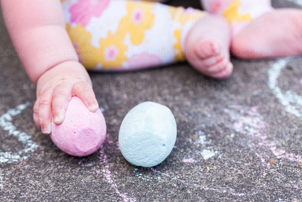 Image of Baby hand holding chalk to draw with - Austockphoto