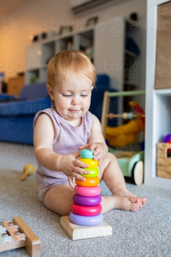 Image of Baby learning through play developing fine motor skills with ...