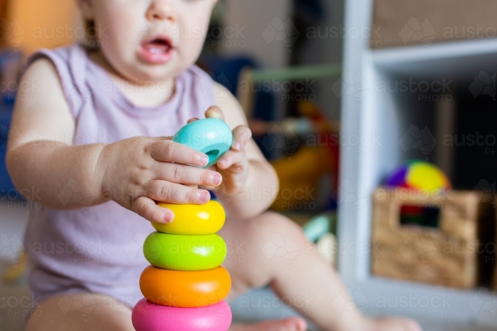Image of Baby learning through play developing fine motor skills with ...