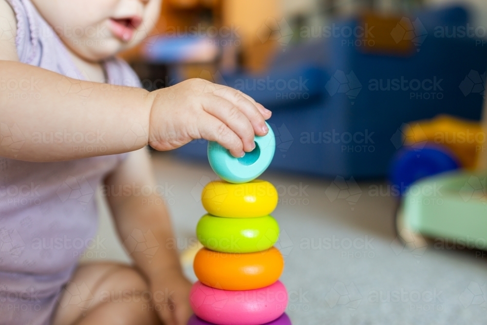 Image of Baby learning through play developing fine motor skills with ...