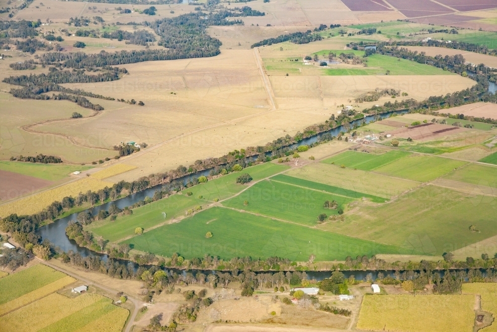 Image of Bend in river running through green paddocks of surrounding ...