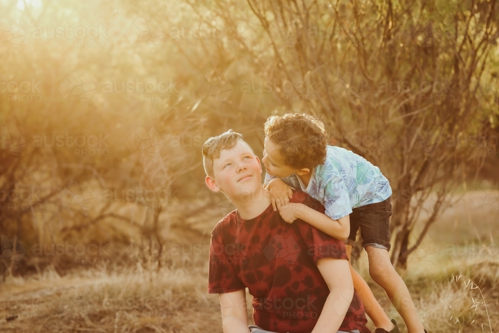 Image of Big and little brother mucking around in the Australian bush ...