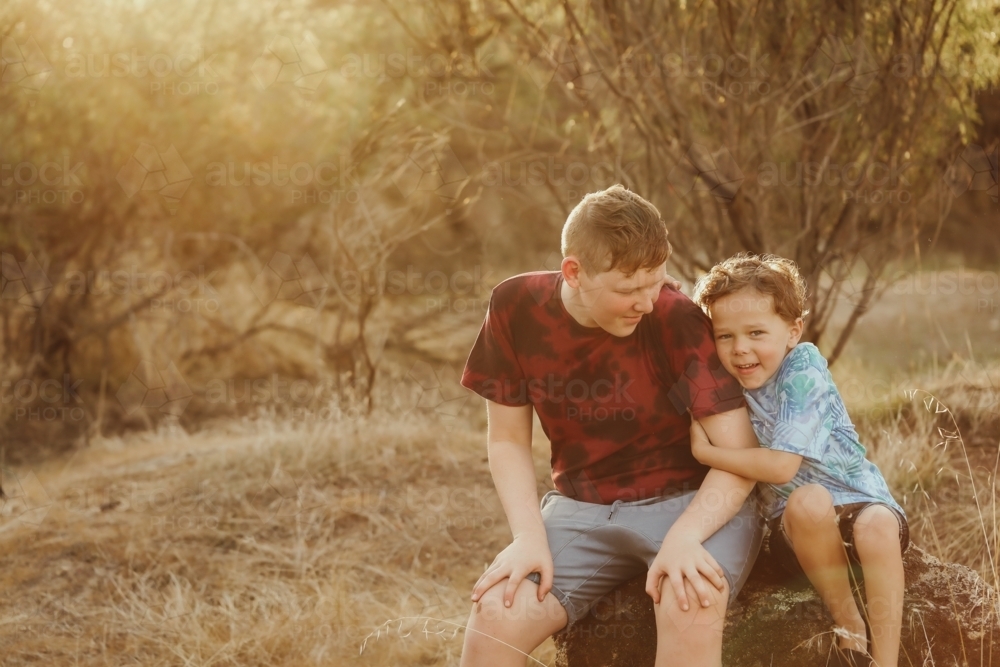 Image of Big and little brother mucking around in the Australian bush ...