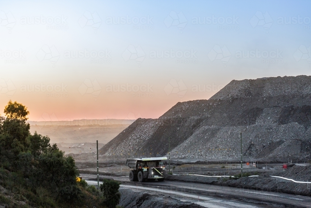 Image of Big machinery working in open cut coal mine at the end of the ...