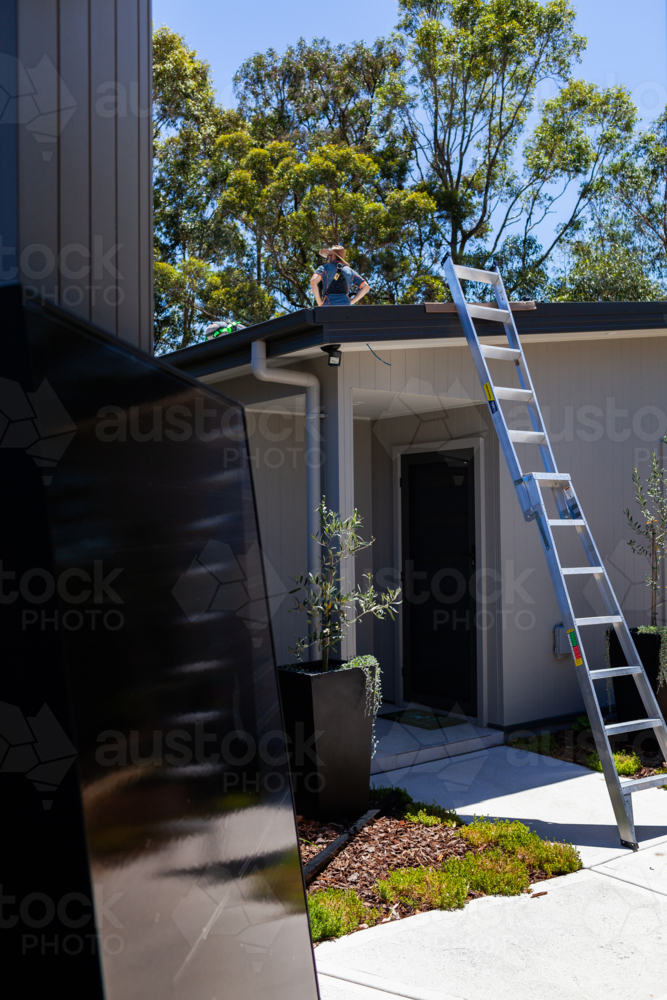 Image of Black bifacial solar panels leaning on wall ready for ...