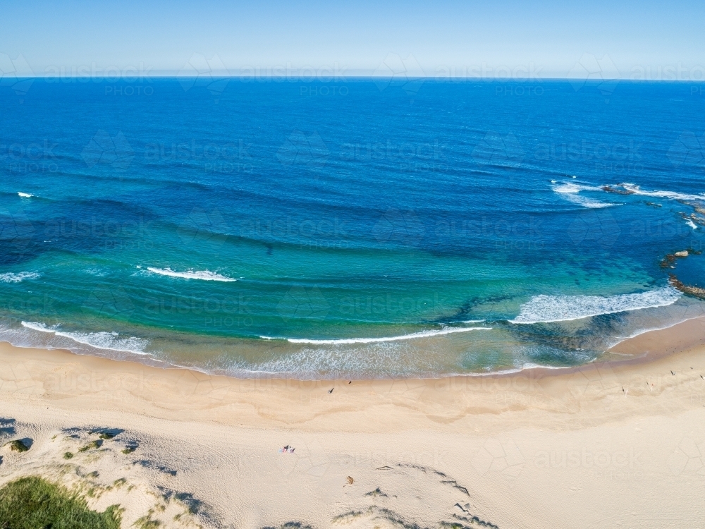 Image of Blue ocean water and sunlit beach in Newcastle NSW seen from ...