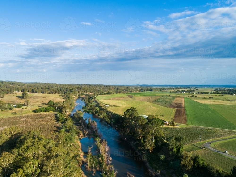 Image of Blue sky reflecting on Hunter River watercourse running beside ...