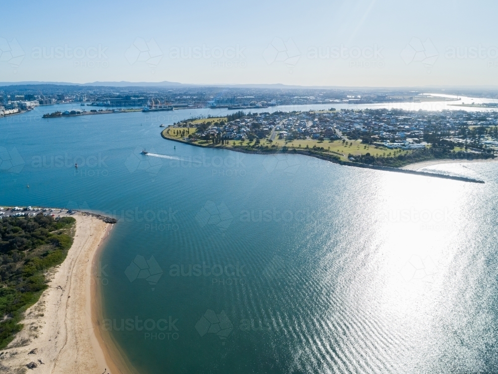Image of Blue sunlit water where the Hunter River meets the sea in the ...