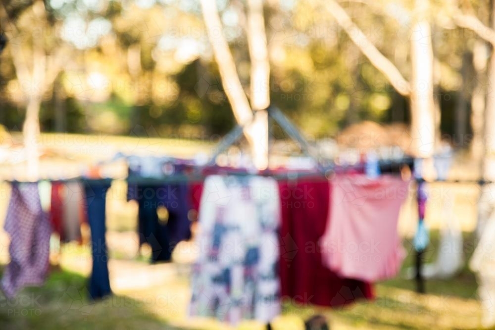 Image of Blurred out of focus photo of a full washing line - Austockphoto