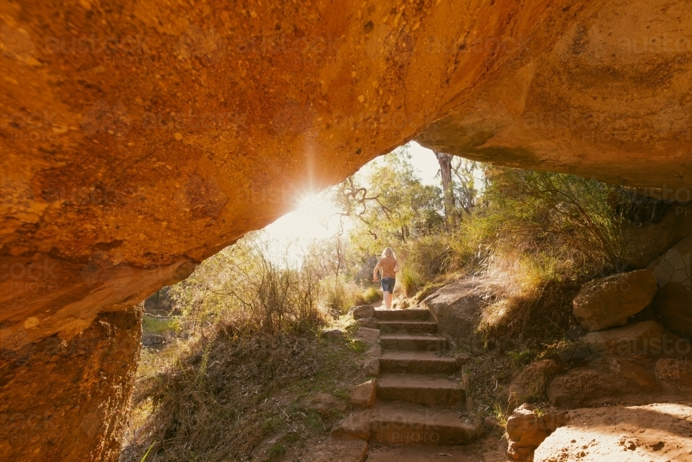 Image of Boy following path through cave at The Drip near Mudgee, NSW ...
