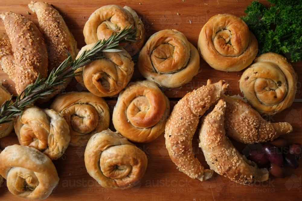 Image of Bread knots and roll platter with herbs - Austockphoto