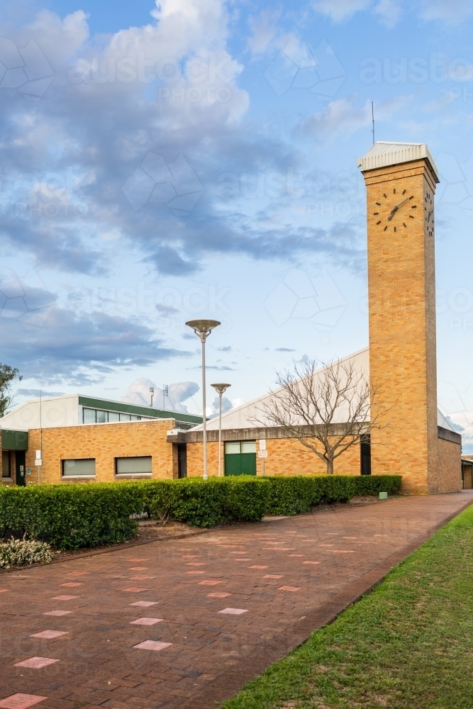 Image of Brick footpath to clock tower and council buildings - Austockphoto
