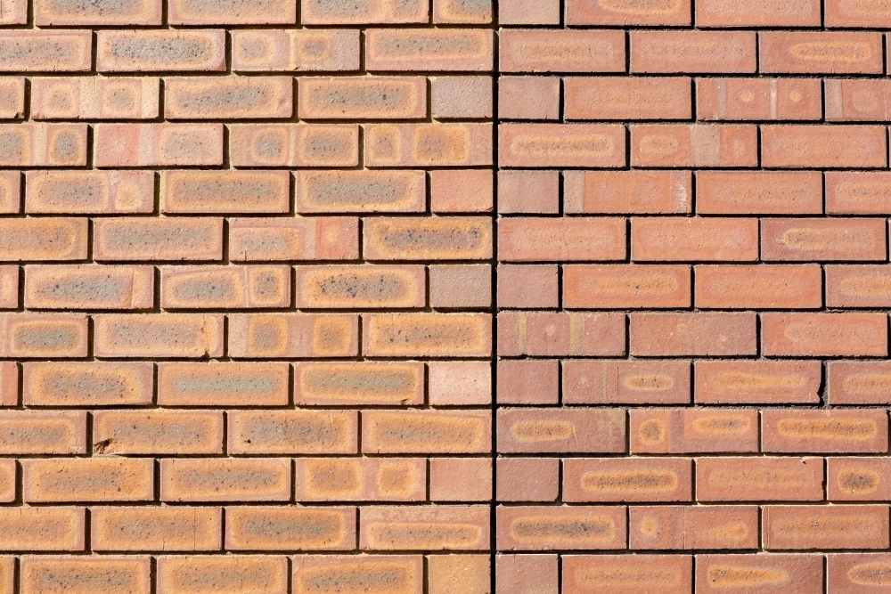 Image of Brick wall with two different style bricks - Austockphoto