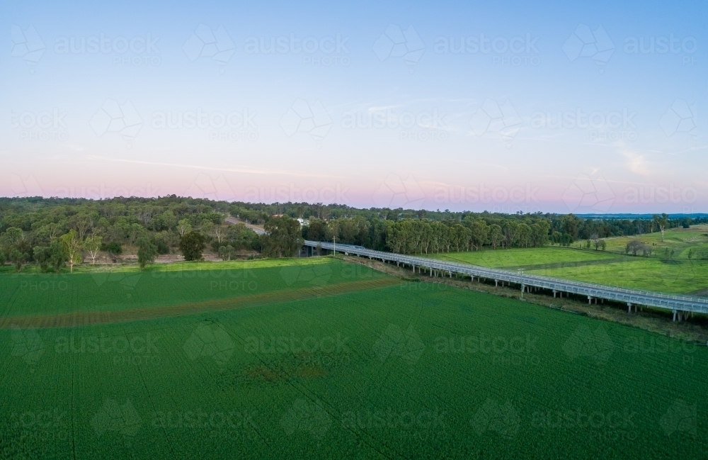Image of Bridge over floodplain growing crop of lucerne alfalfa feed ...