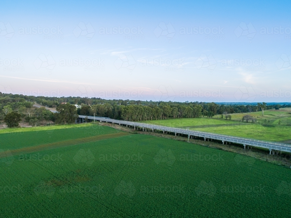Image of Bridge over floodplain growing crop of lucerne alfalfa feed ...