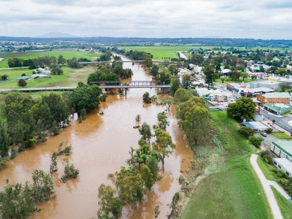 Image of Bridge over river with receding floodwaters in flood aftermath ...