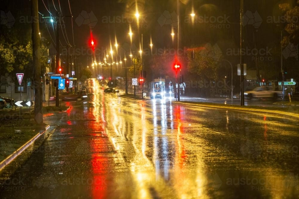 Image of Bright light reflections on a rainy night - Austockphoto
