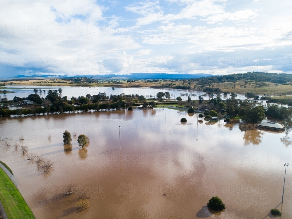 Image of Bright sky as rain subsides and flood water starts to recede ...