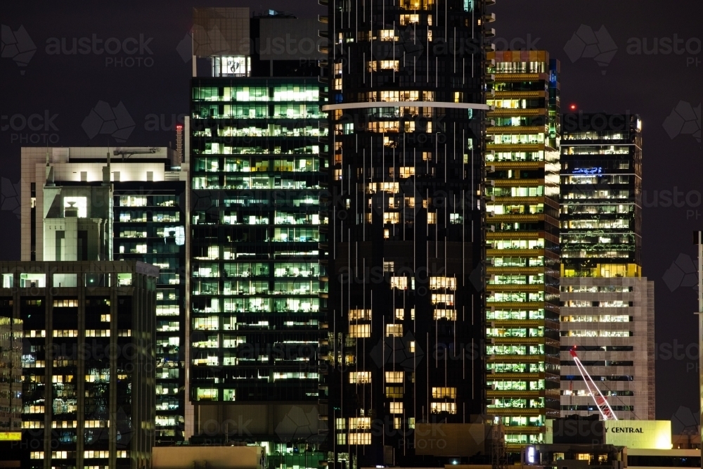 Image of Brisbane city high rise facades at night - Austockphoto