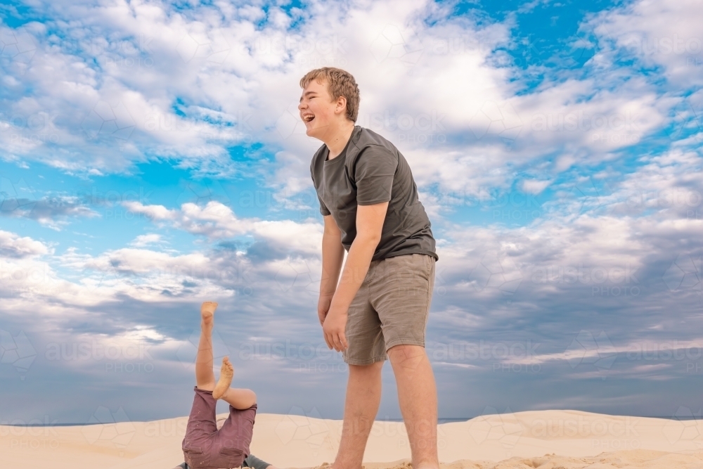 Image of Brothers having fun on the sand dunes at Stockton Beach NSW ...
