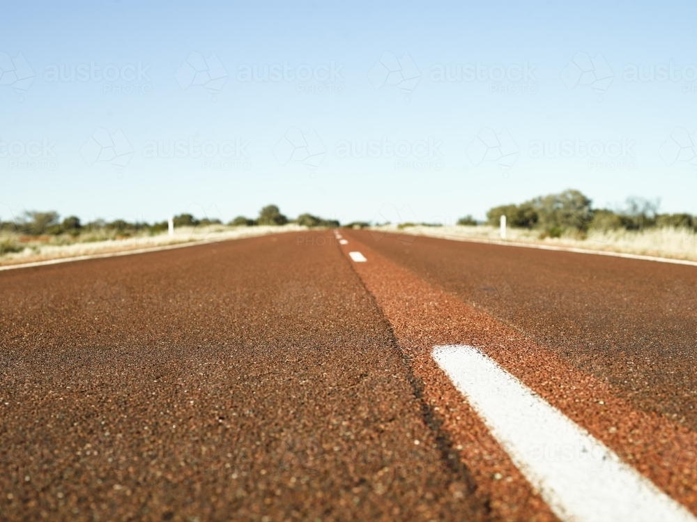 Image of Brown bitumen highway in outback - Austockphoto