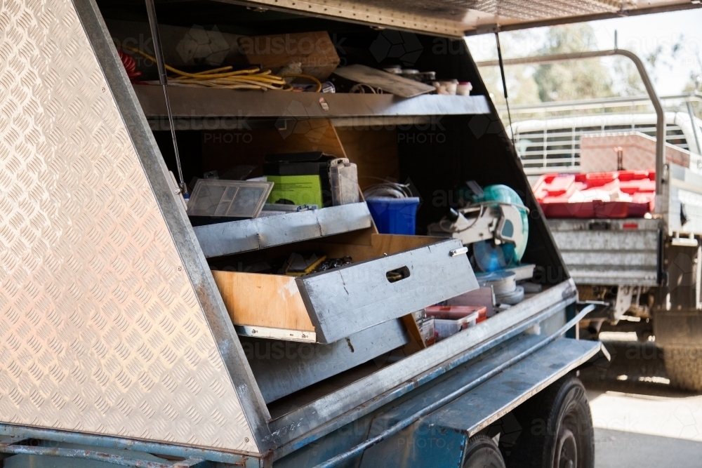 Image of Builders ute and trailer full of tools - Austockphoto