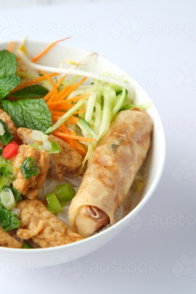 Image of Bun Cha Gio bowl topped with fried spring roll and Cha Lua ...