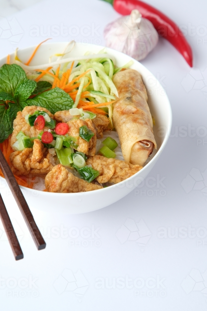 Image of Bun Cha Gio bowl topped with fried spring roll and Cha Lua ...