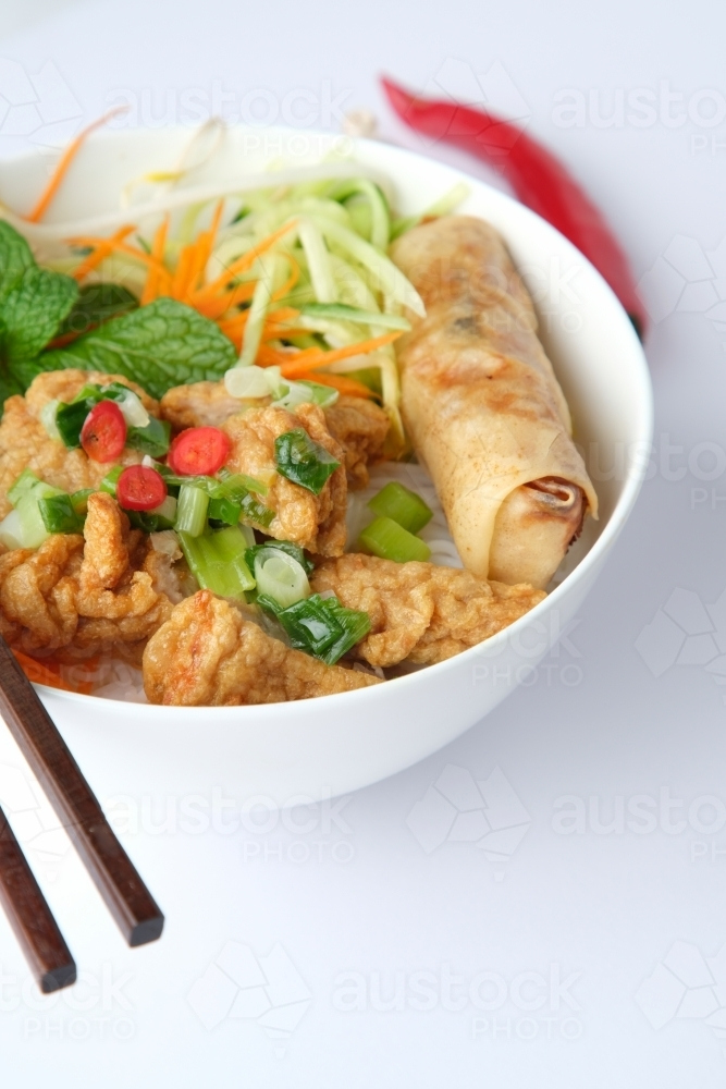 Image of Bun Cha Gio bowl topped with fried spring roll and Cha Lua ...