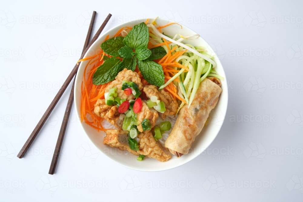Image of Bun Cha Gio bowl topped with fried spring roll and Cha Lua ...