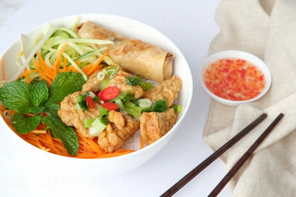 Image of Bun Cha Gio bowl topped with fried spring roll and Cha Lua ...