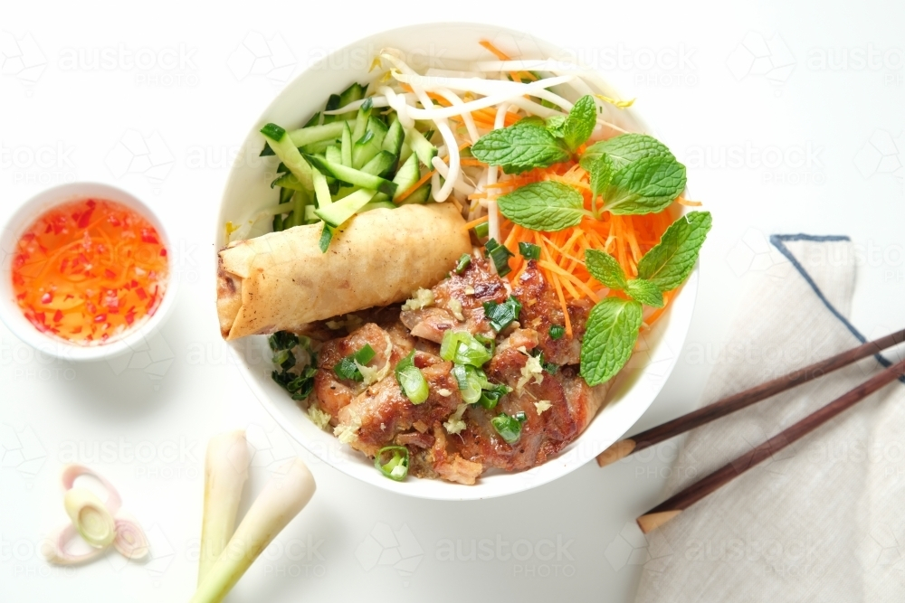Image of Bun Cha Gio bowl with meat slices topped with fried spring ...