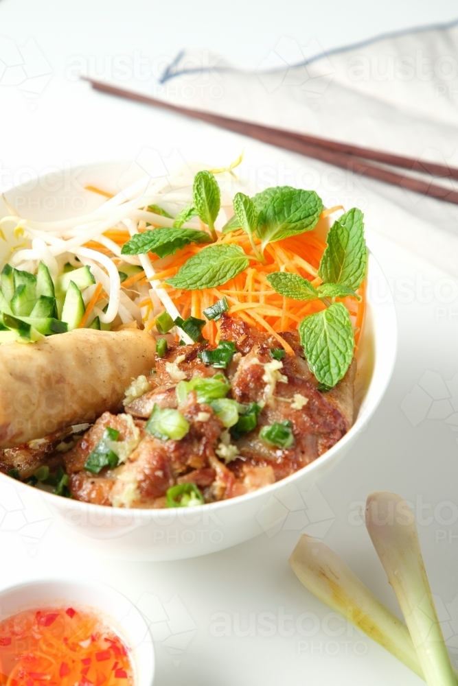 Image of Bun Cha Gio bowl with meat slices topped with fried spring ...