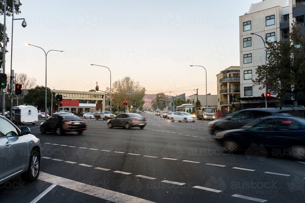 Image of busy intersection at dusk - Austockphoto