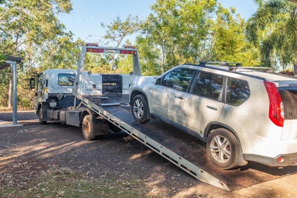 Image of Car being loaded onto tow truck - Austockphoto