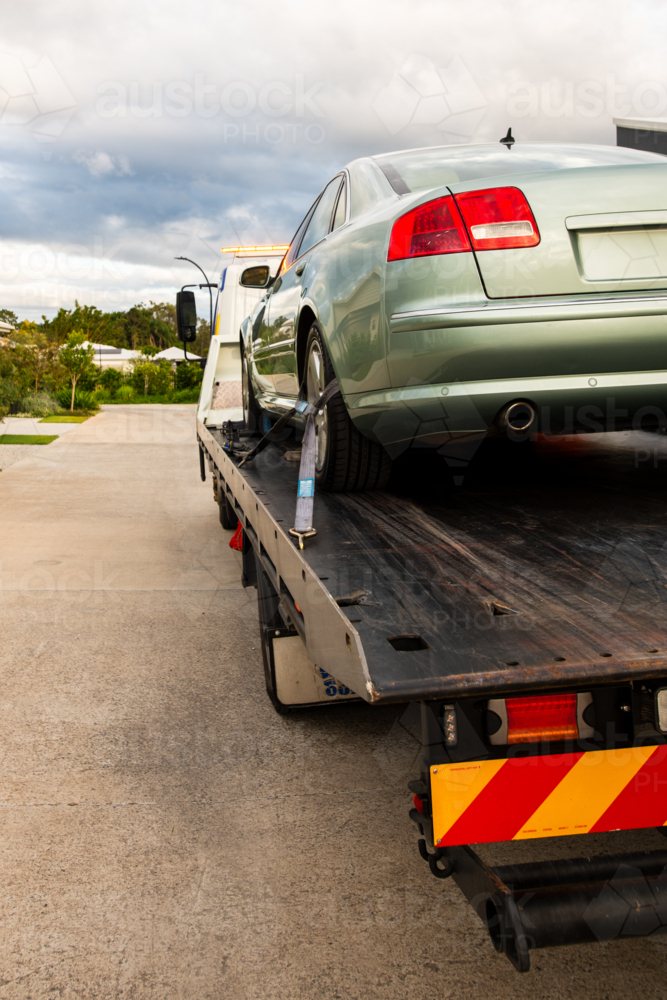 Image of car being put on a tow truck - Austockphoto