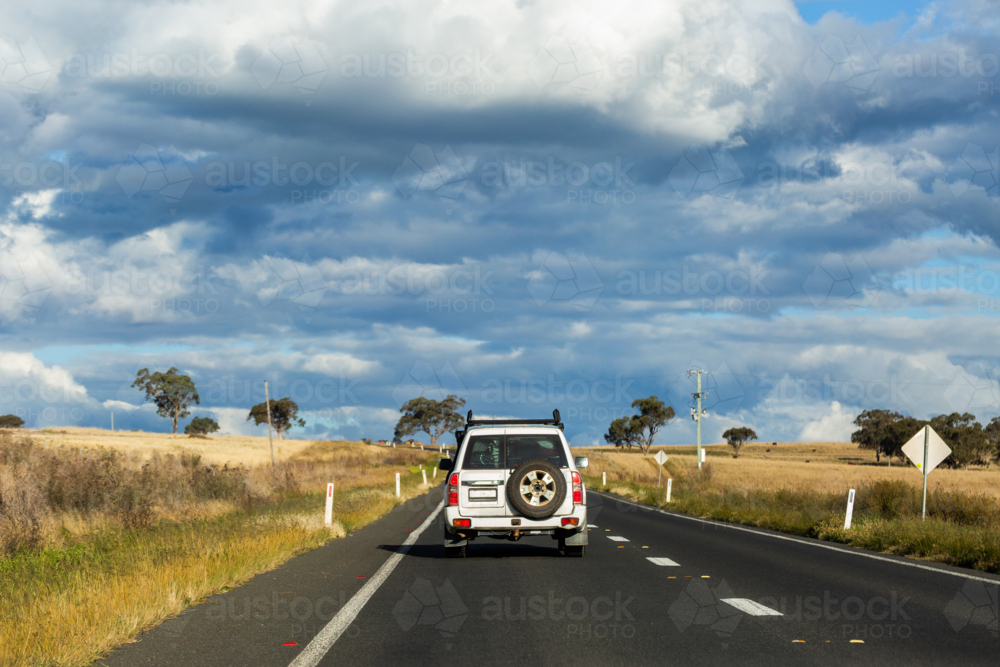 Image of Car driving on highway road in rural Australia - Austockphoto